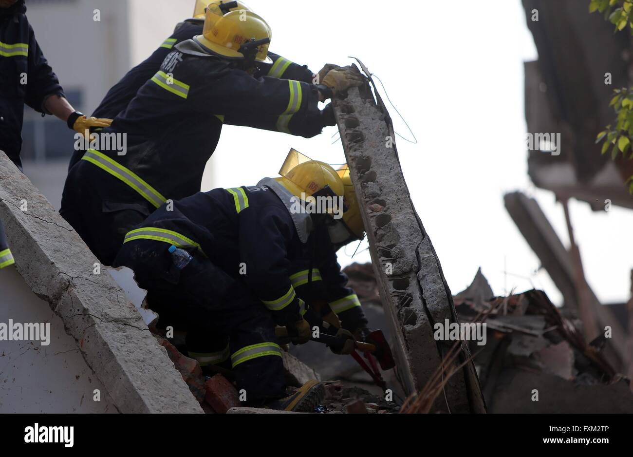 Beijing, China. 17th Apr, 2016. Rescuers search for trapped people at ...