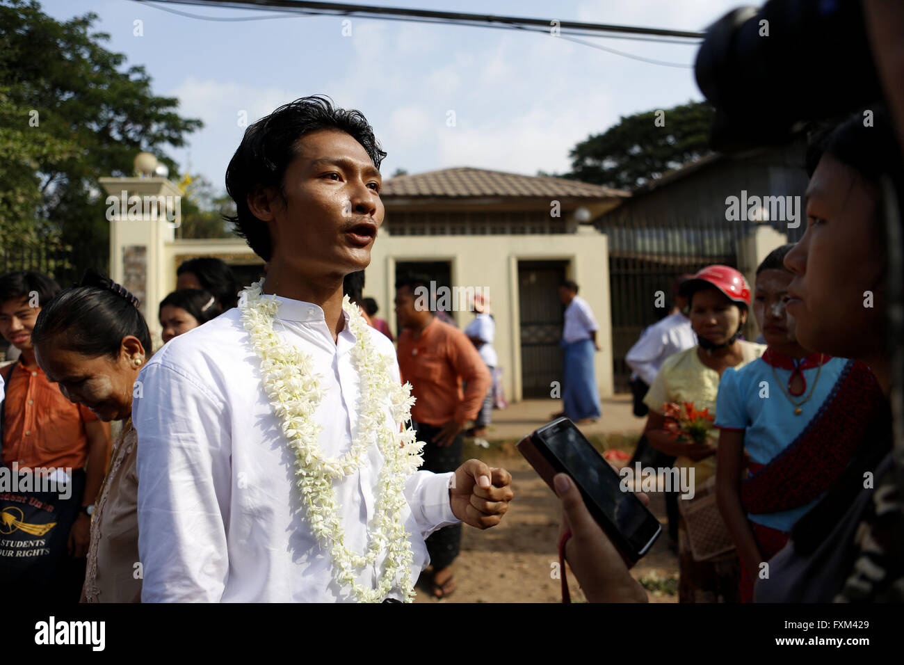 Yangon, Myanmar. 17th Apr, 2016. A released prisoner (L) receives an ...