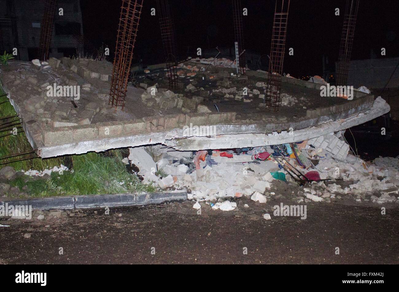 Quito, Ecuador. 16th Apr, 2016. Debris of a house are seen after an ...