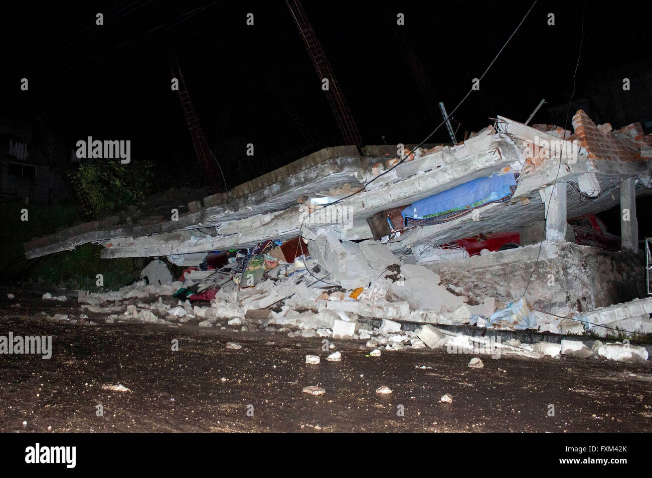 Quito, Ecuador. 16th Apr, 2016. Debris of a house are seen after an ...