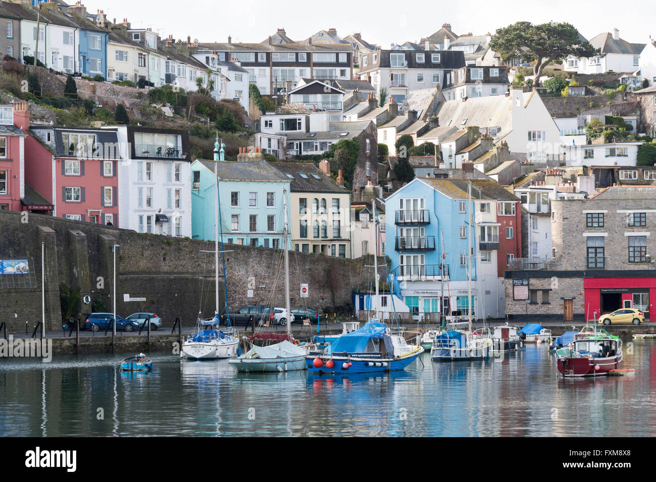 Fishing boats moored in the harbour at the fishing port of Brixham ...