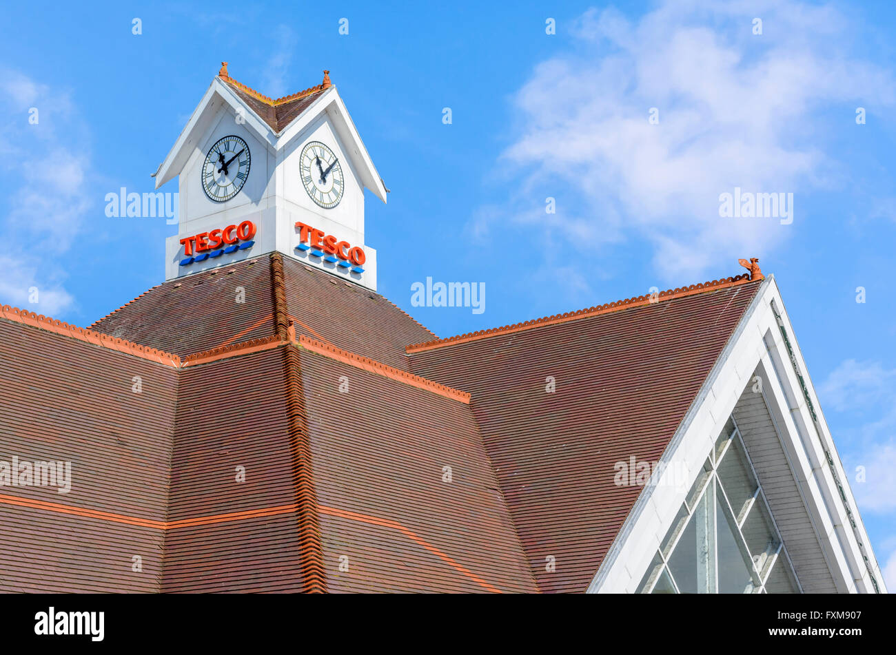 Roof and clock on a Tesco supermarket store in the UK Stock Photo - Alamy