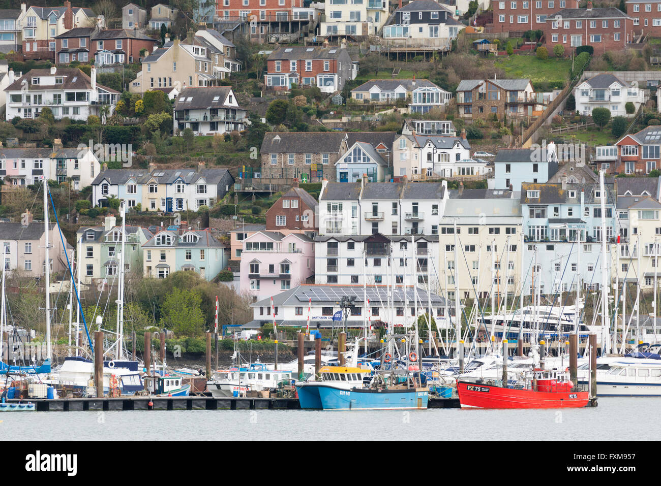Fishing boats moored in the harbour at the fishing port of Brixham ...