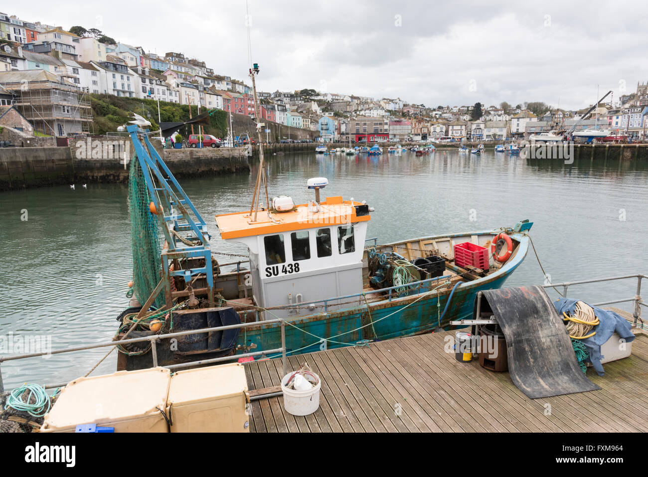 Fishing boats moored in the harbour at the fishing port of Brixham ...