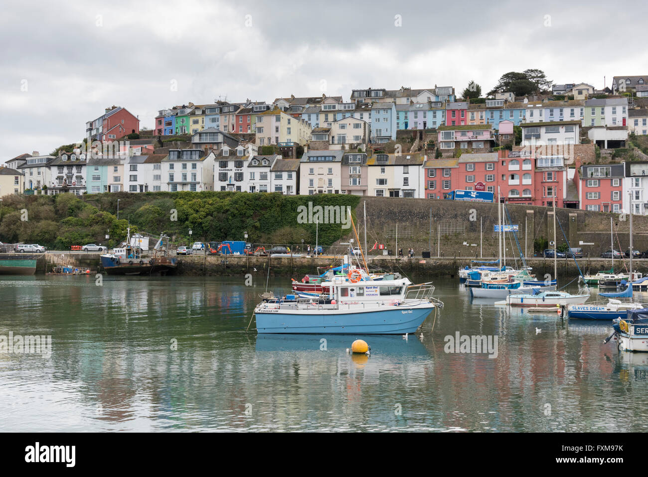 Fishing boats moored in the harbour at the fishing port of Brixham ...