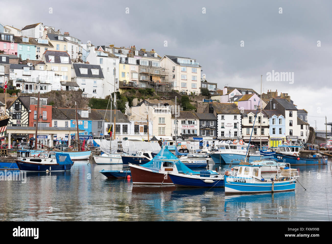 Fishing boats moored in the harbour at the fishing port of Brixham ...