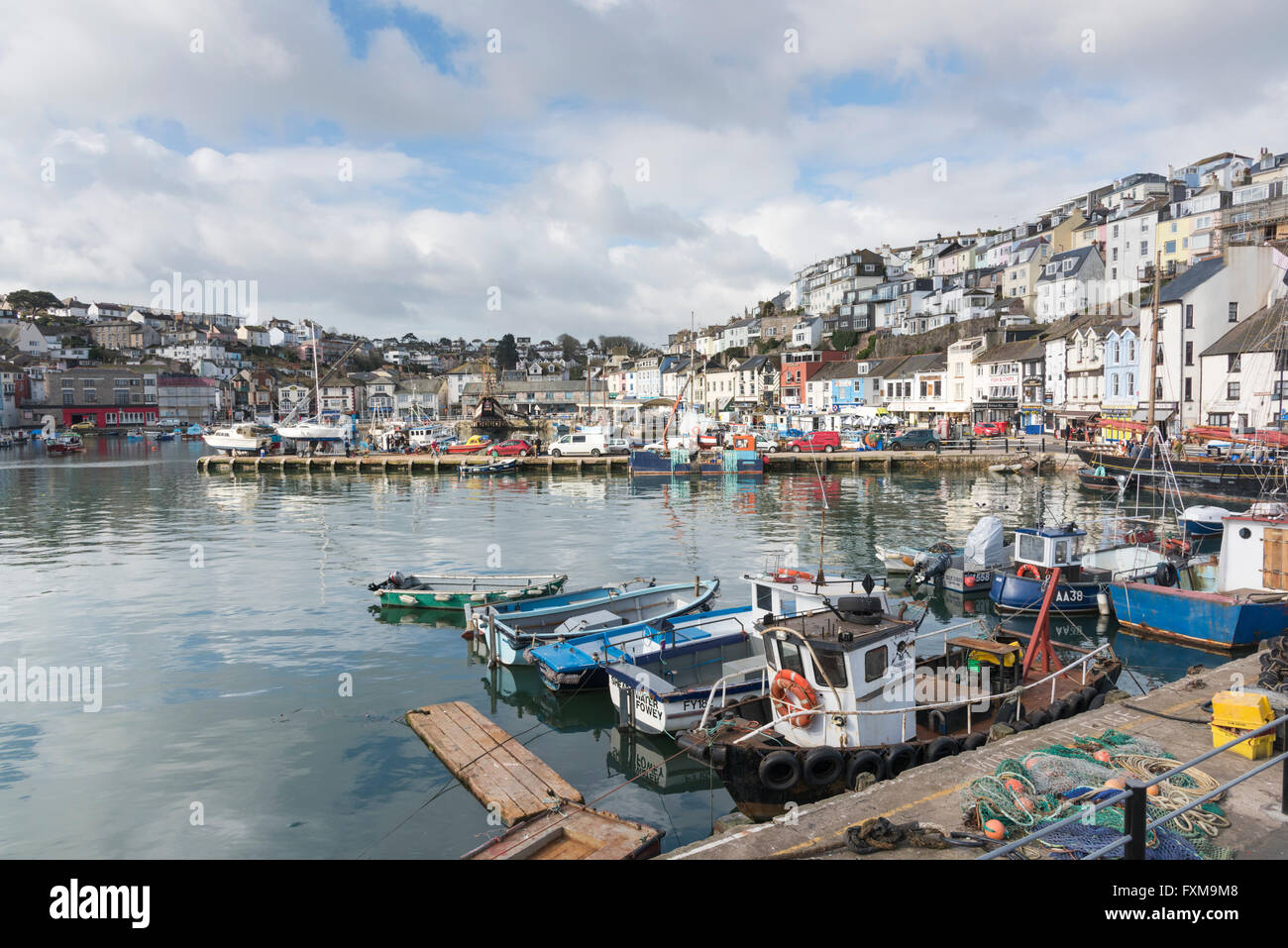 Fishing boats moored in the harbour at the fishing port of Brixham ...