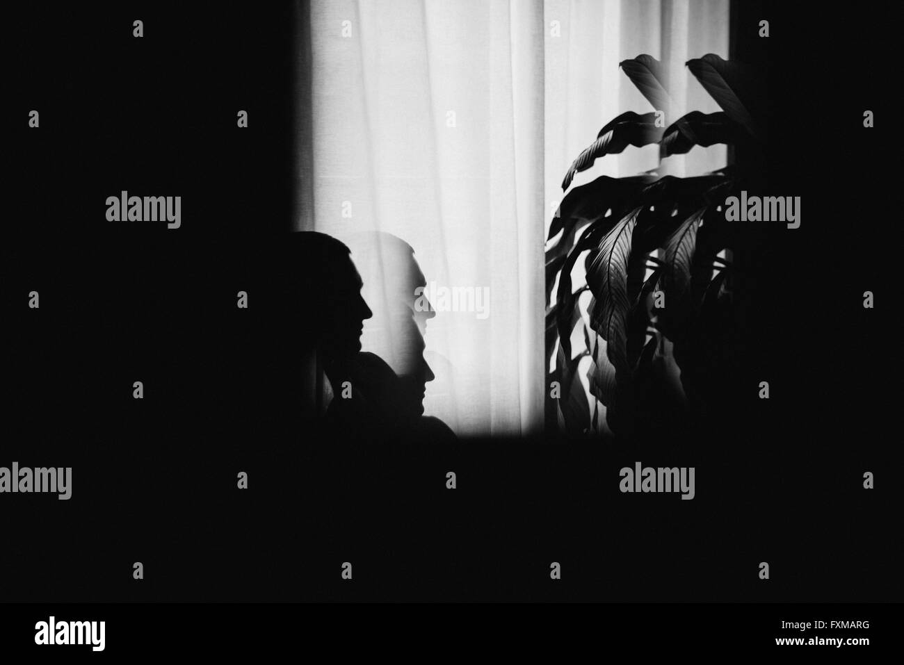 Man hiding shadows hi-res stock photography and images - Alamy