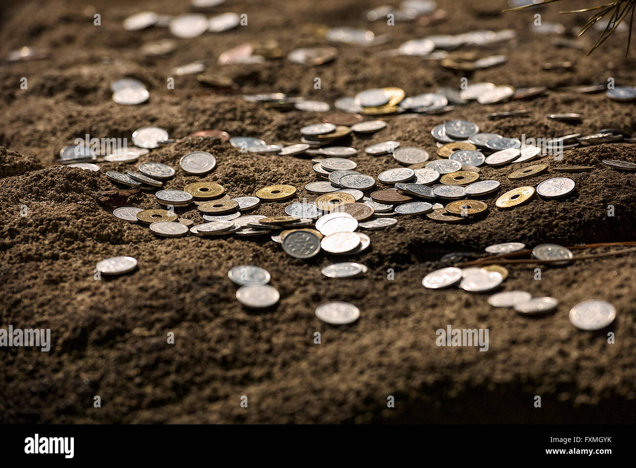 Coins on Rock, Takamatsu, Japan Stock Photo - Alamy