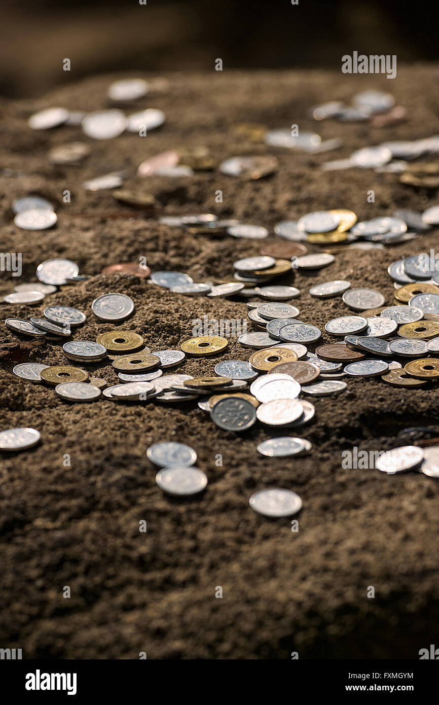 Coins on Rock, Takamatsu, Japan Stock Photo - Alamy