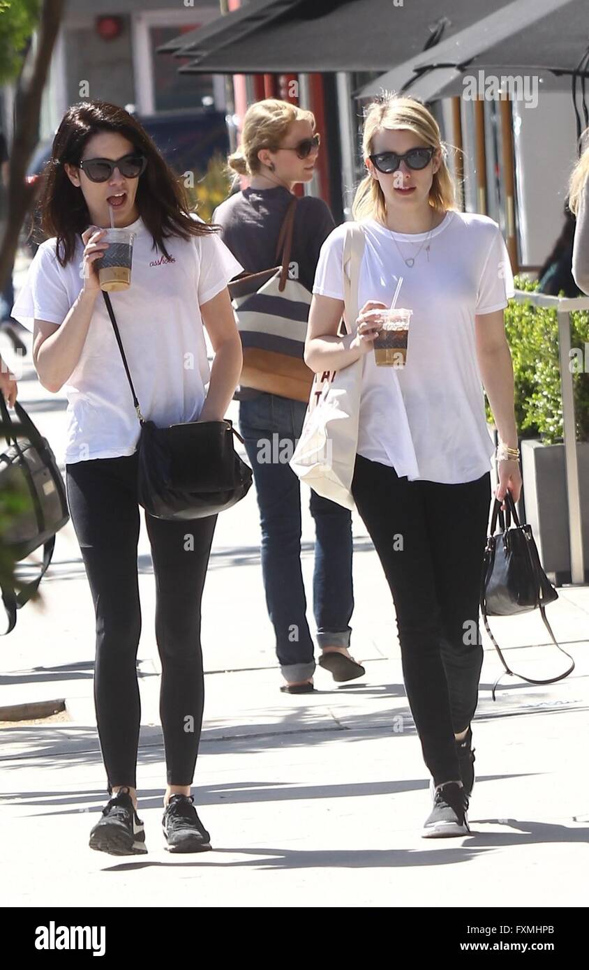 Emma Roberts picks up a cold beverage while out with a friend Featuring ...