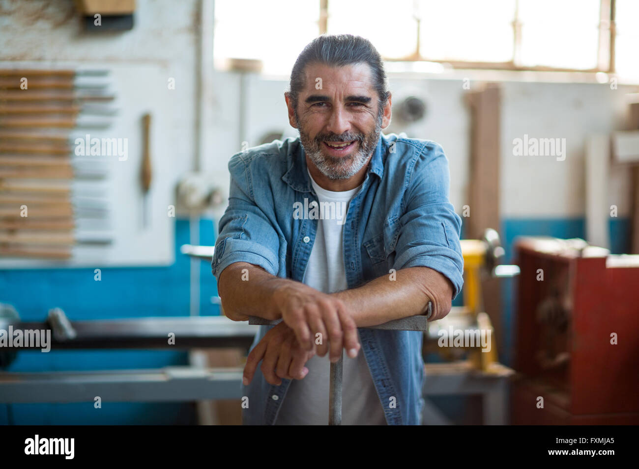 Portrait of happy carpenter standing in workshop Stock Photo - Alamy