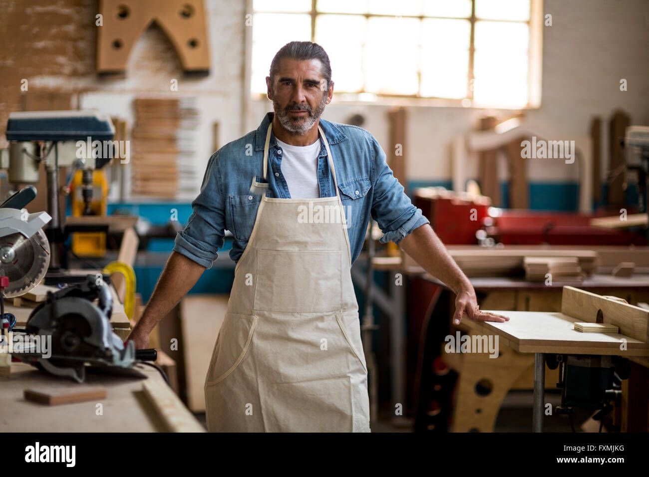 Portrait of carpenter standing in workshop Stock Photo - Alamy