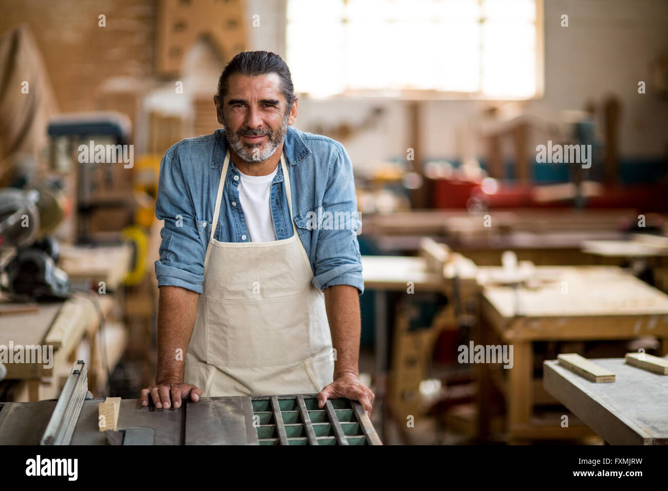 Carpenter standing in workshop Stock Photo - Alamy