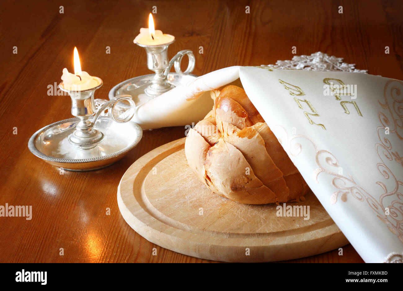 shabbat image. challah bread, shabbat wine and candelas on wooden table ...
