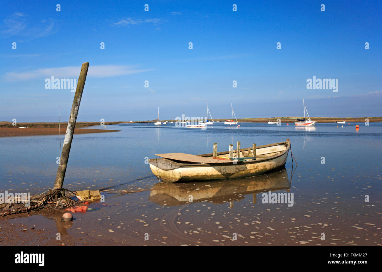 A view of the harbour with small boats at Brancaster Staithe, Norfolk ...