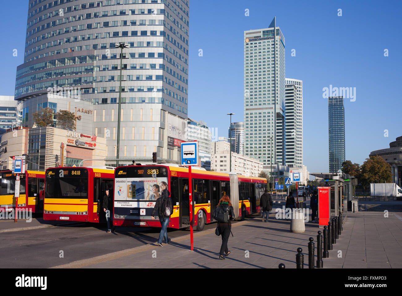 City downtown of Warsaw in Poland, buses, bus stop terminal on Emilii ...
