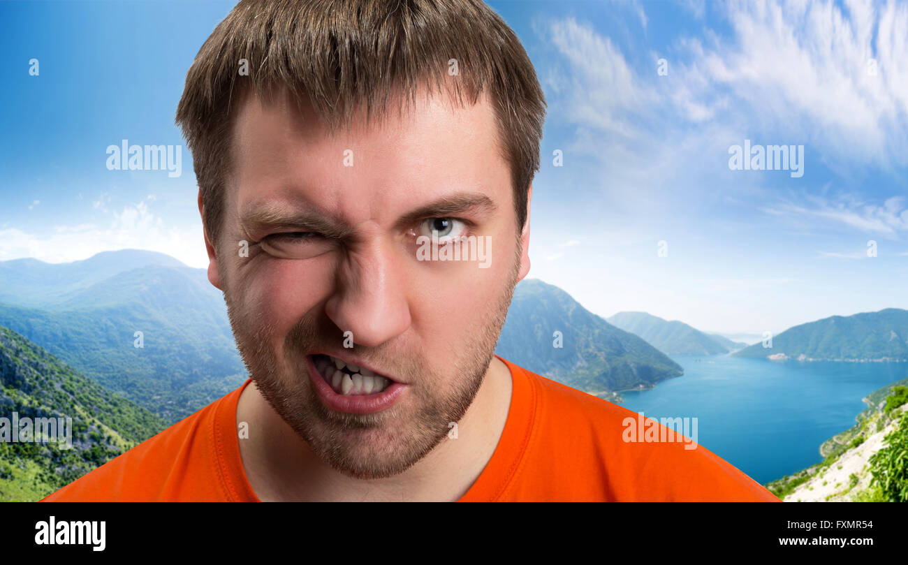 Angry man screaming against landscape Stock Photo - Alamy