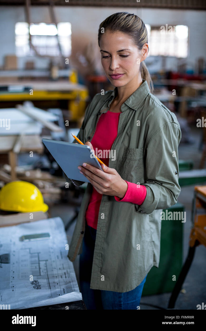 Beautiful female carpenter using hi-res stock photography and images ...