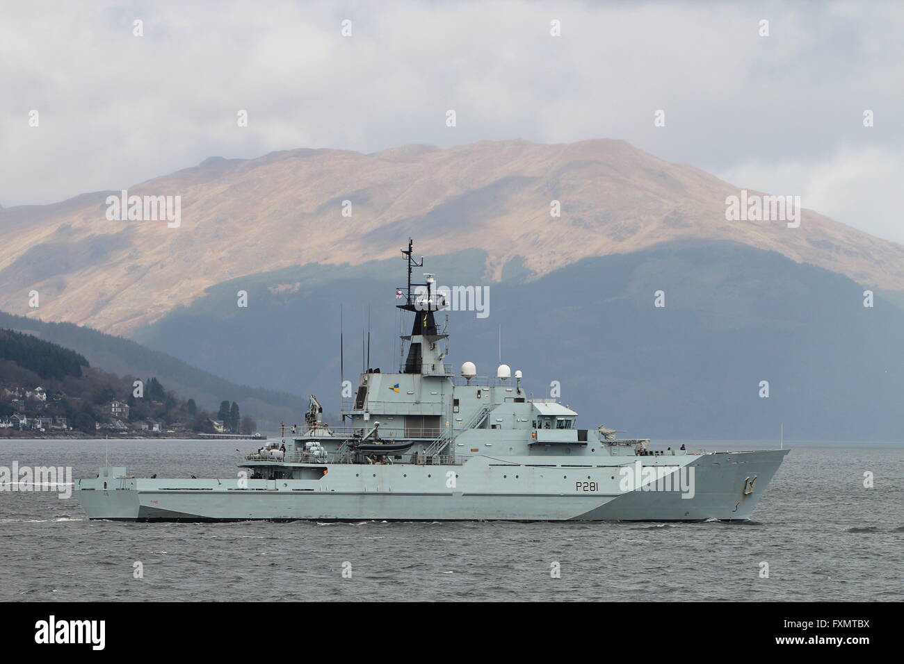 HMS Tyne (P281), a River-class patrol vessel of the Royal Navy, passes ...