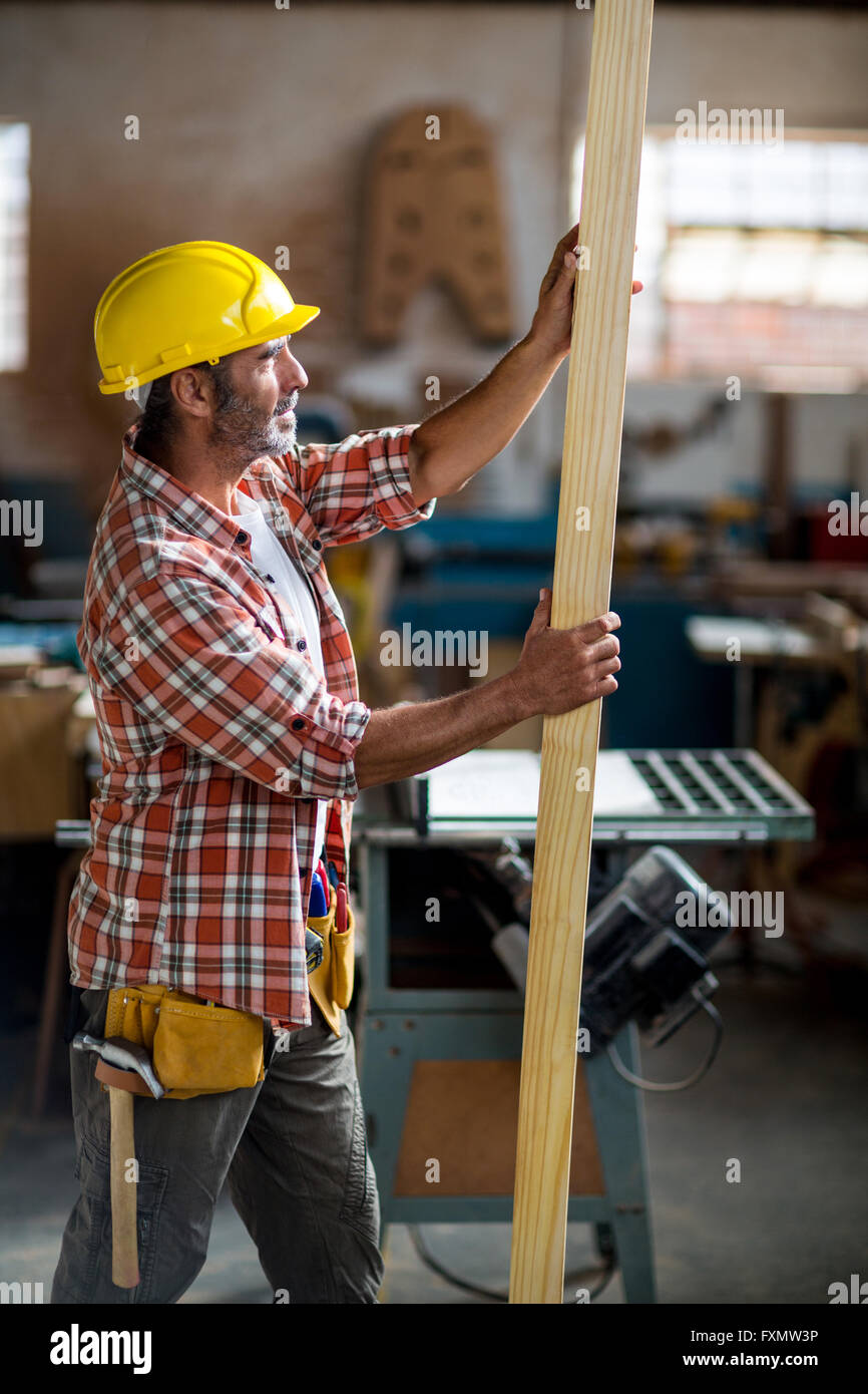 Carpenter looking wood plank hi-res stock photography and images - Alamy