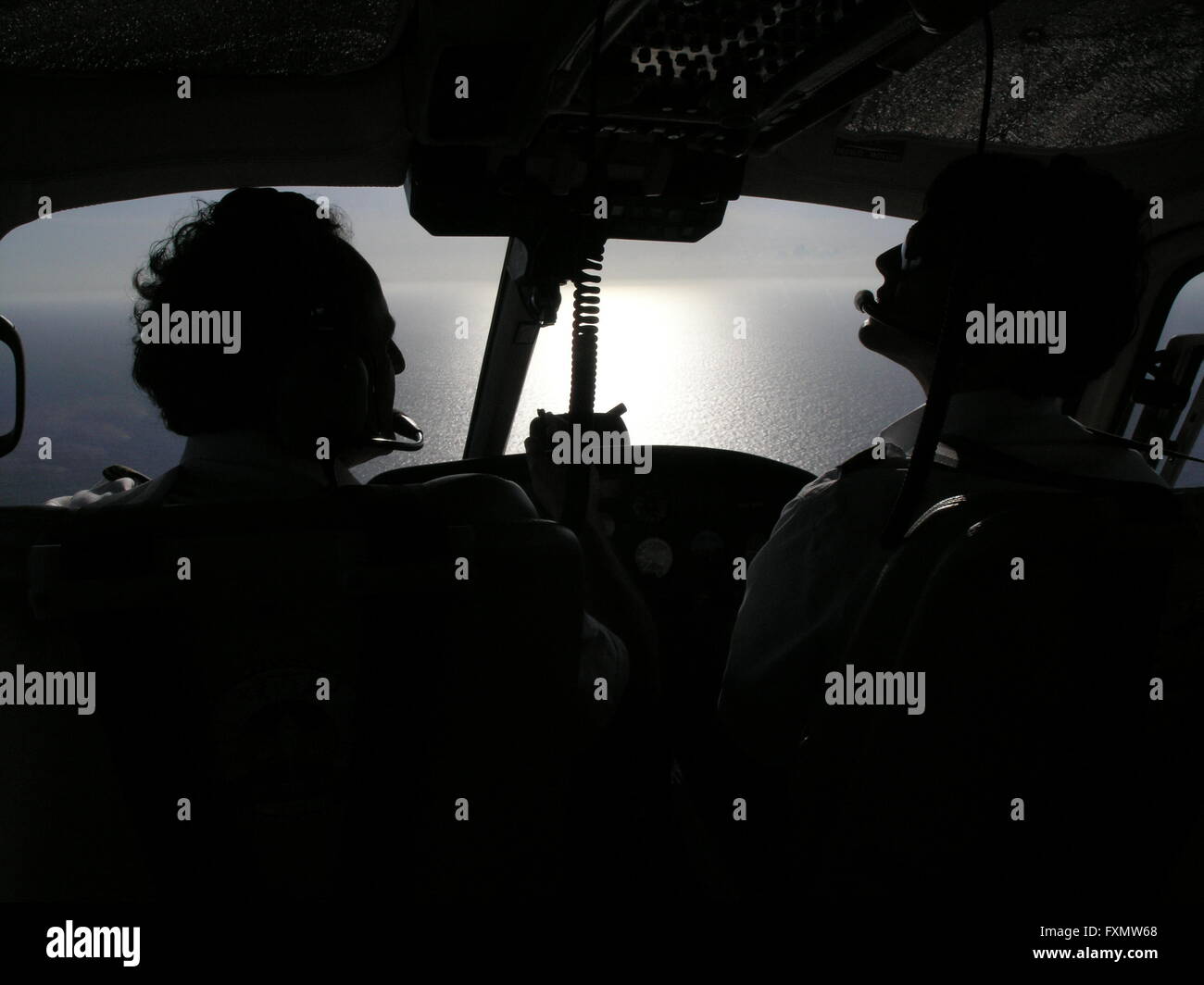 Helicopter flying over sea hi-res stock photography and images - Alamy