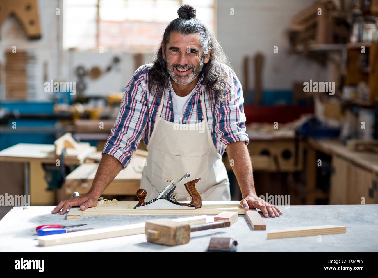 Portrait of carpenter in workshop Stock Photo - Alamy