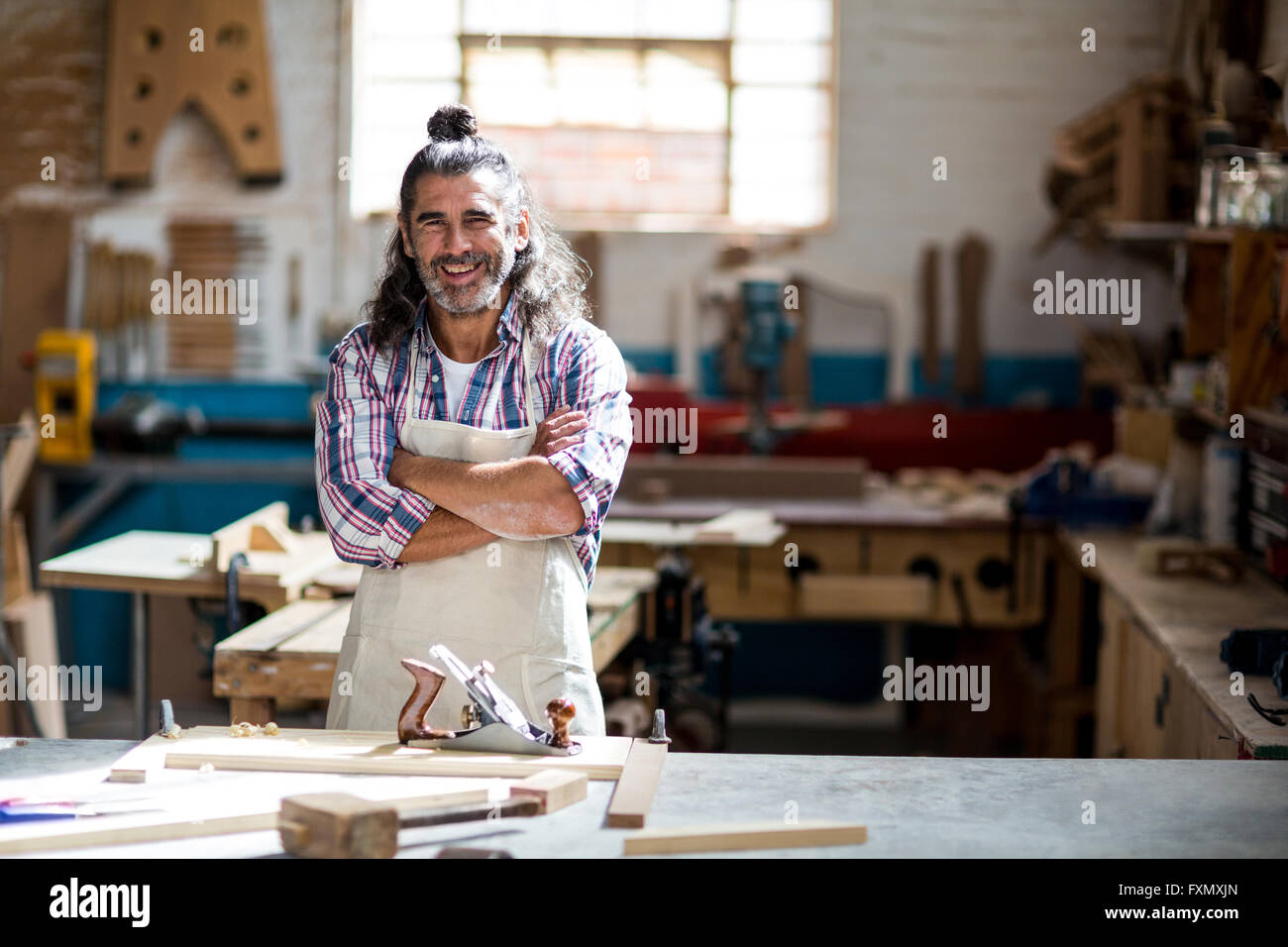 Happy carpenter man arms hi-res stock photography and images - Alamy