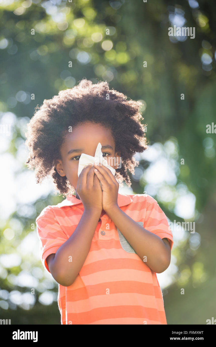 A kid is blowing his nose Stock Photo - Alamy