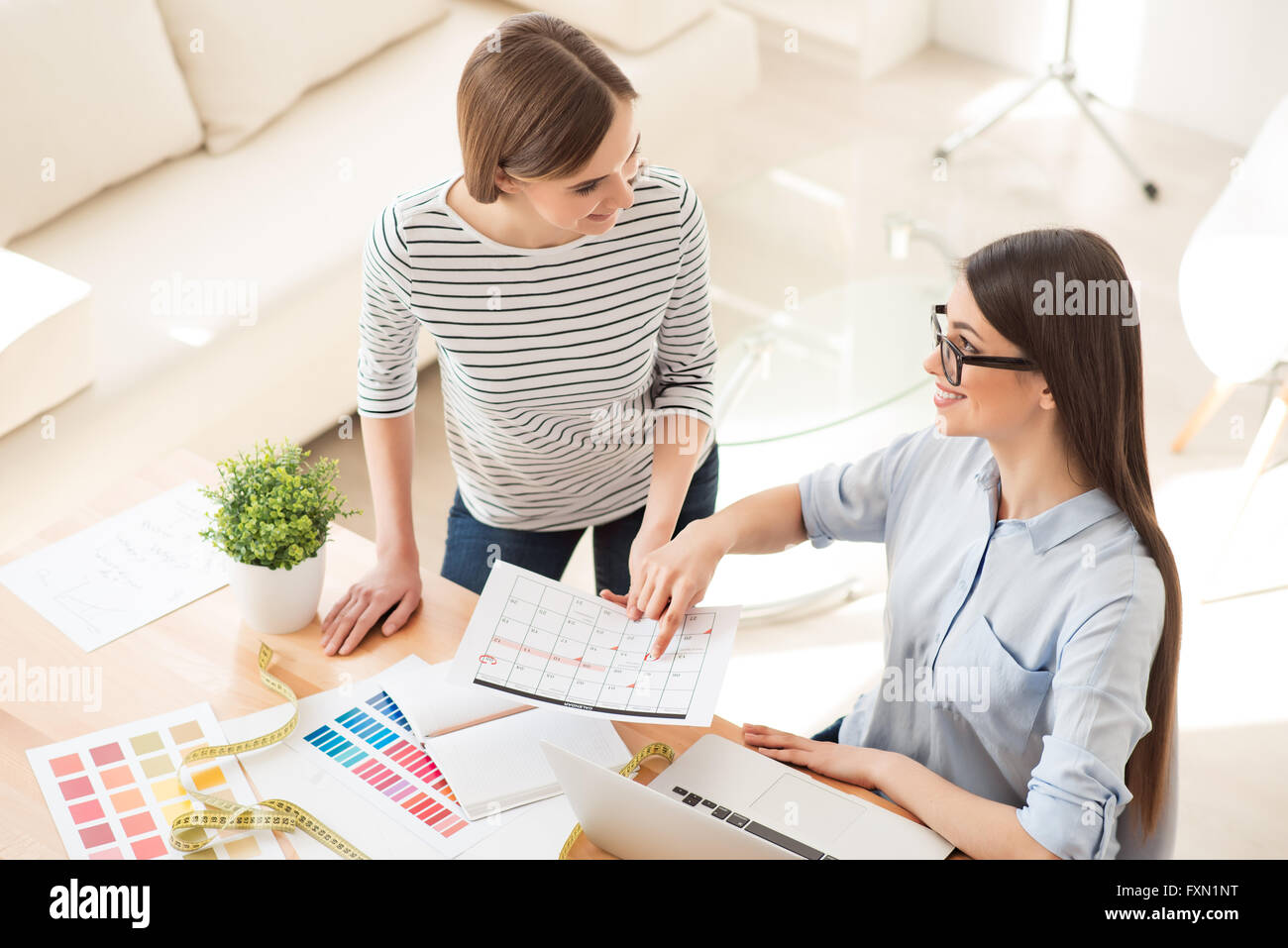 Cheerful girls talking with each other Stock Photo - Alamy