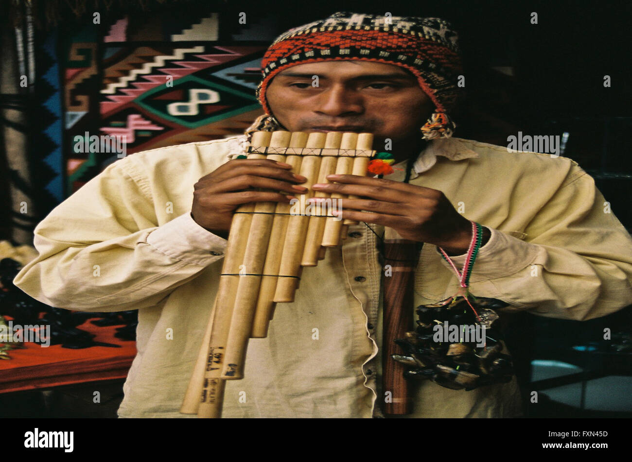 Quechua Indian man performs pan flut in Cusco, Peru and selling his ...