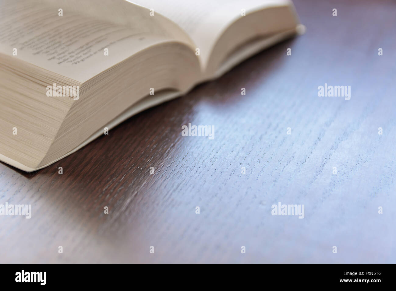 open book on a rustic wooden table Stock Photo - Alamy