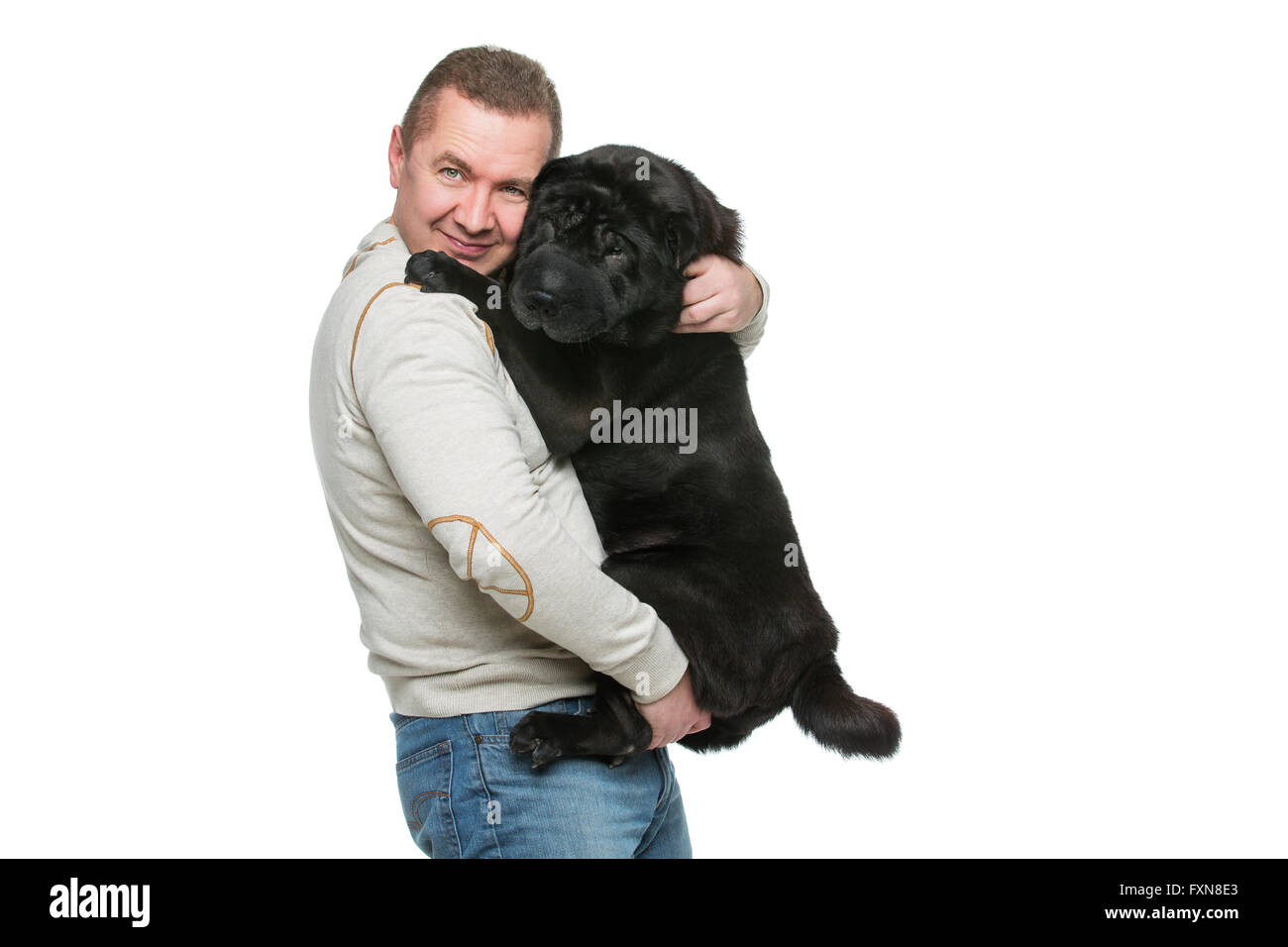 Man with sharpei dog Stock Photo - Alamy