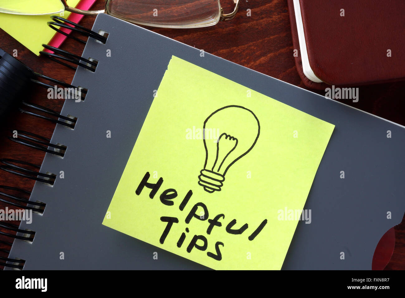 Helpful tips written on a paper. Business concept Stock Photo - Alamy