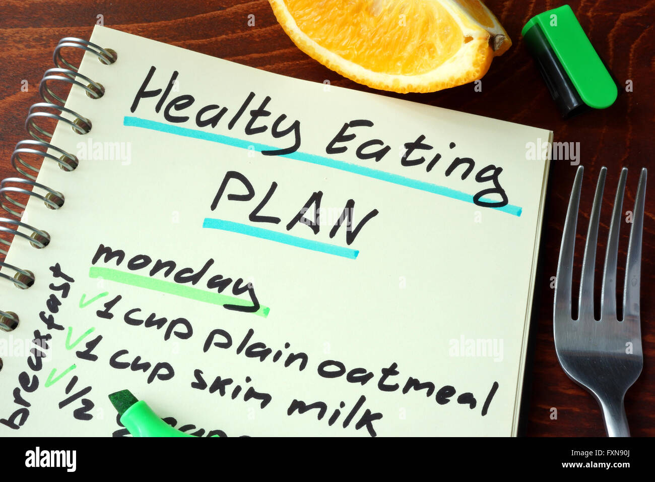 Notepad with sign healthy eating plan on a wooden background Stock ...