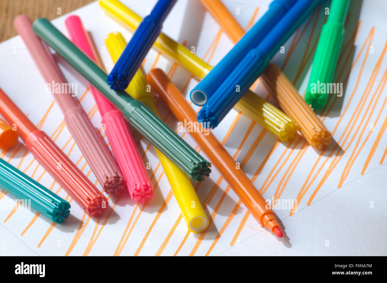 multicolored markers and white paper sheet Stock Photo - Alamy