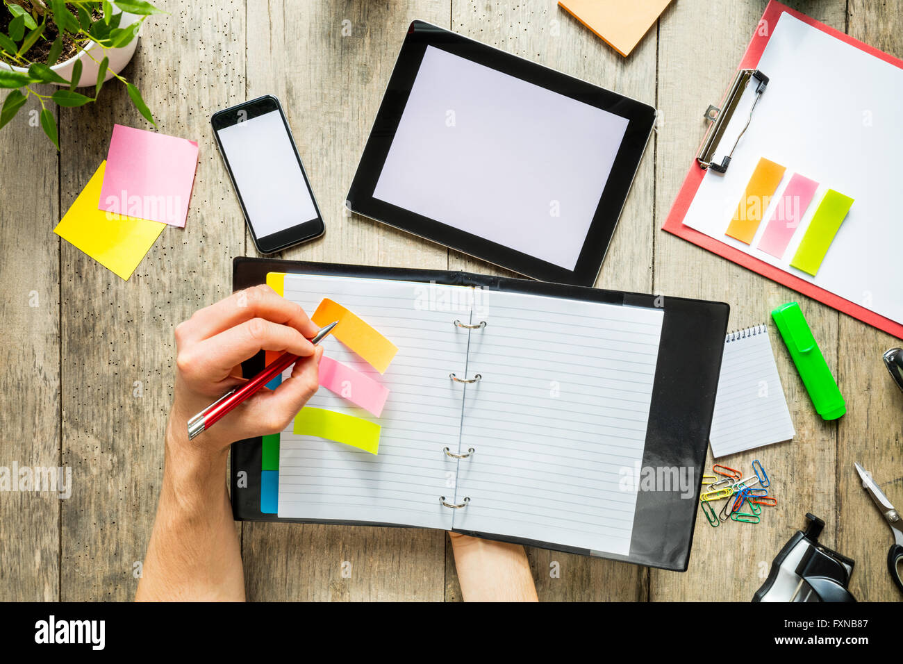Businessman hands holding notepad Stock Photo - Alamy