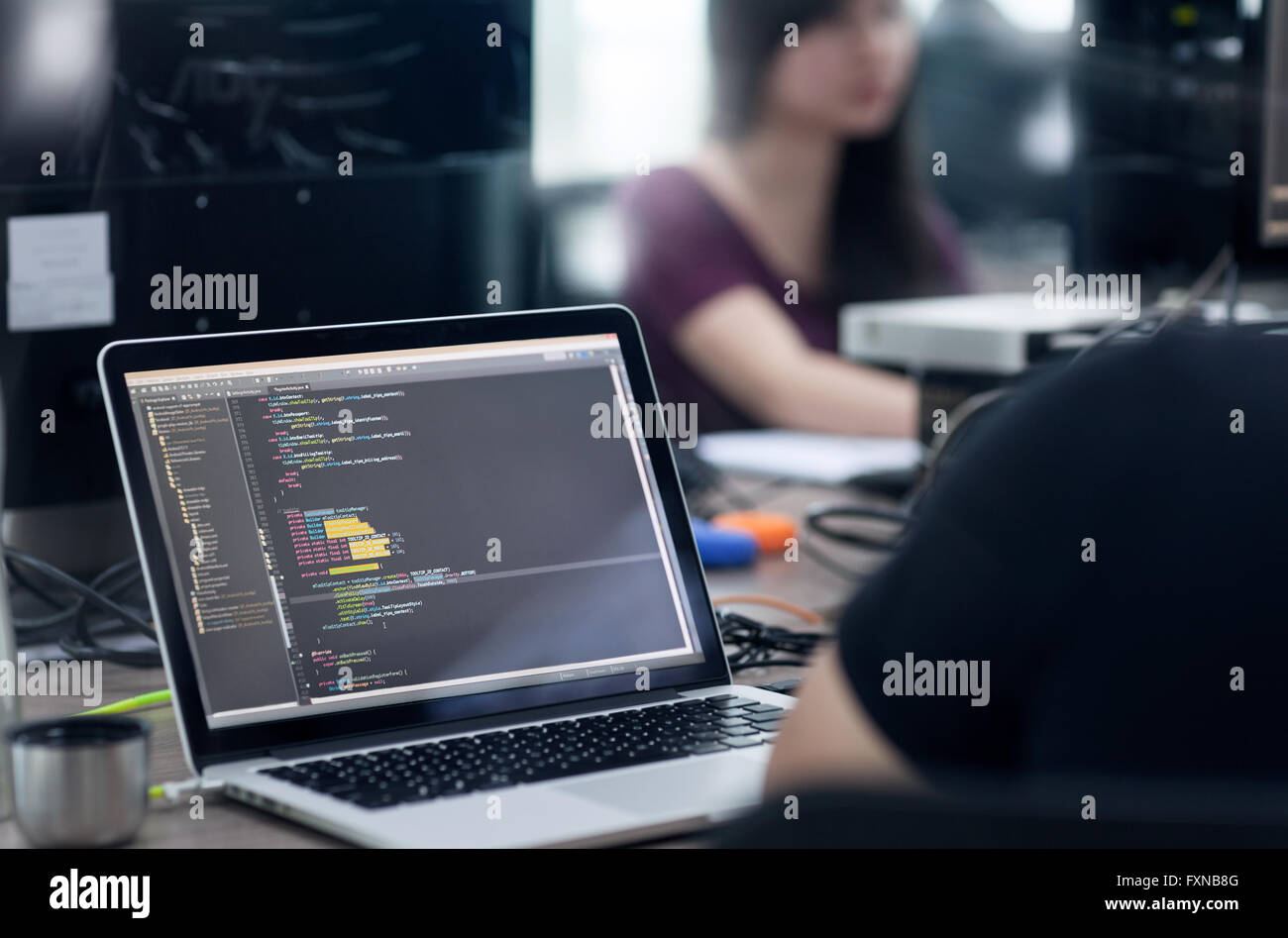 Asian woman sitting desk coding hi-res stock photography and images - Alamy