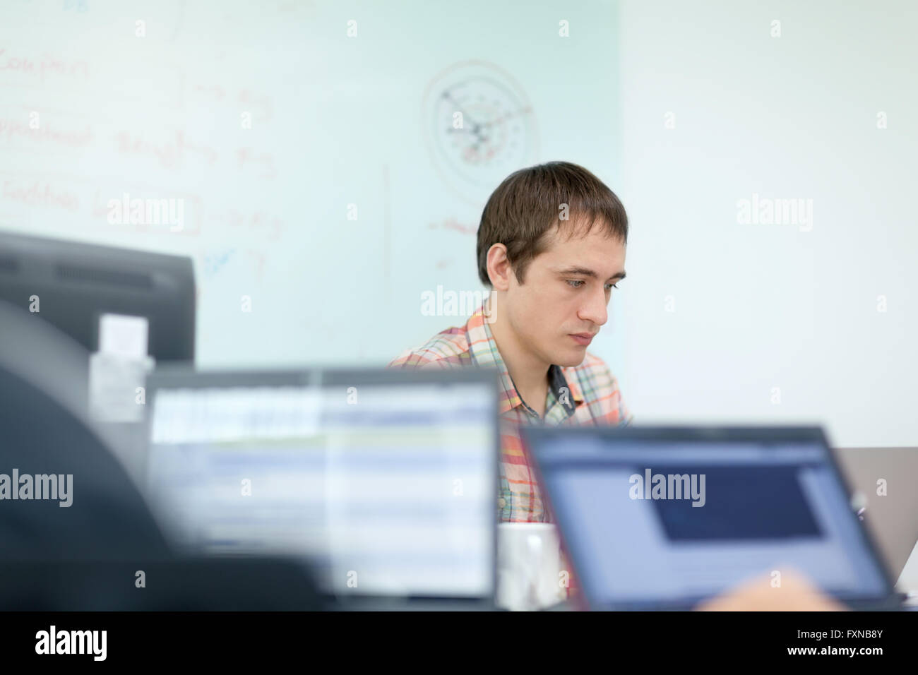 Businessman working laptop sitting office desk Stock Photo - Alamy