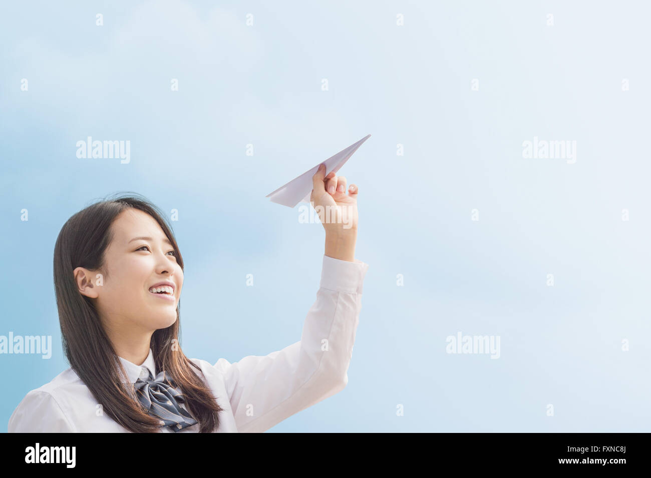 Japanese high-school student with paper plane Stock Photo - Alamy