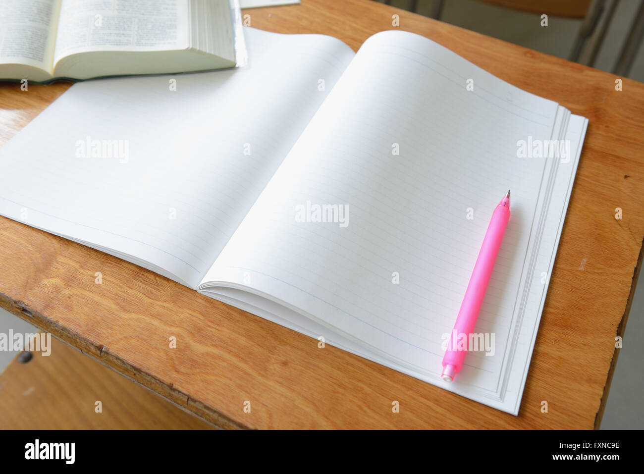 Notebook on school desk Stock Photo - Alamy