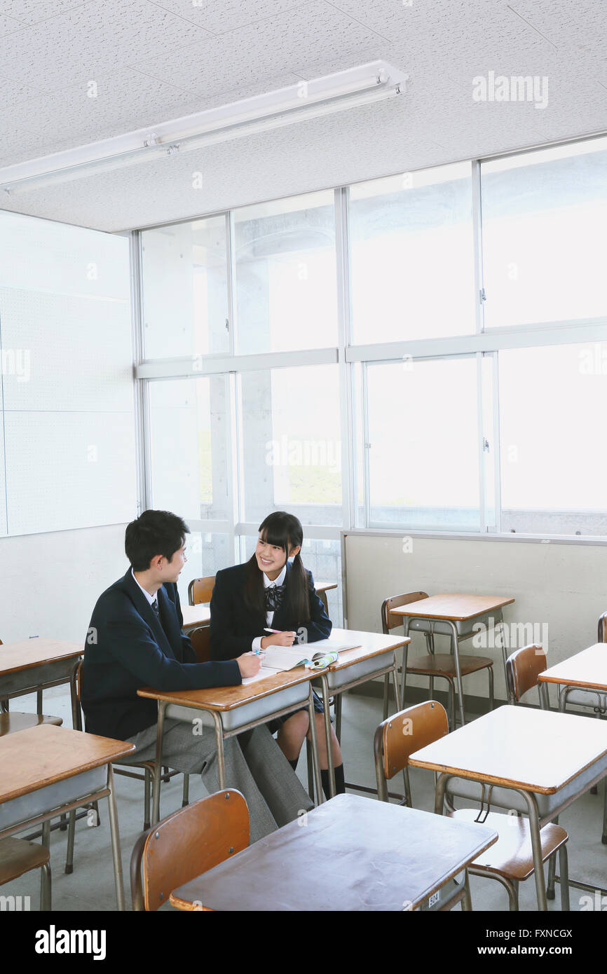 Two school girls in classroom hi-res stock photography and images - Alamy