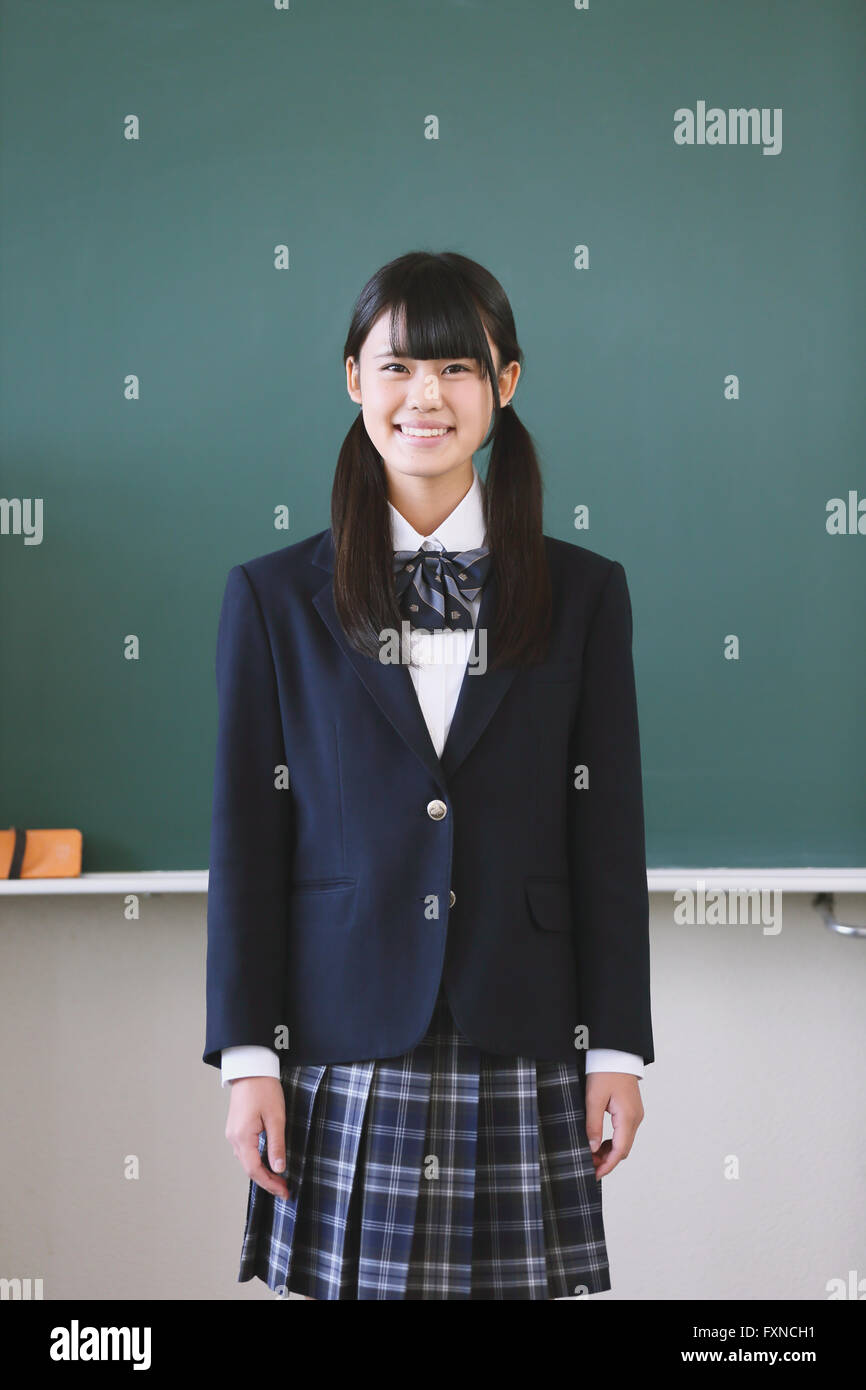 Japanese high-school student in front of classroom blackboard Stock ...