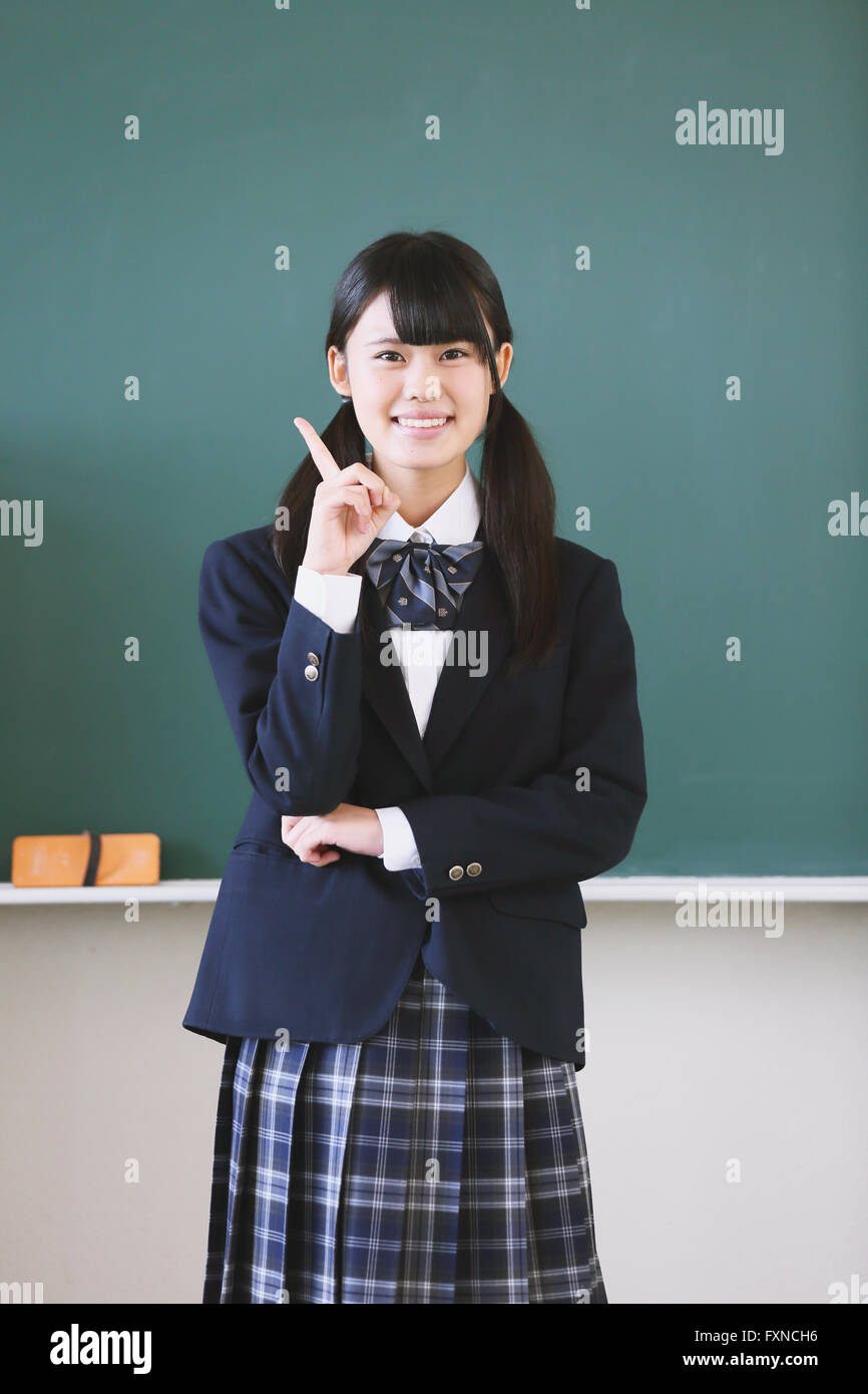 Japanese high-school student in front of classroom blackboard Stock ...