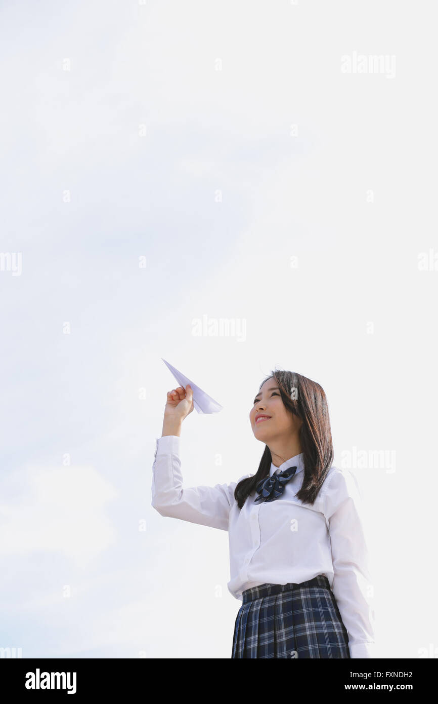 Japanese high-school student with paper plane Stock Photo - Alamy