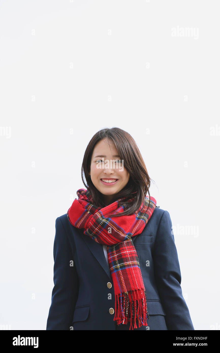 Japanese high-school student with scarf against blue sky Stock Photo ...