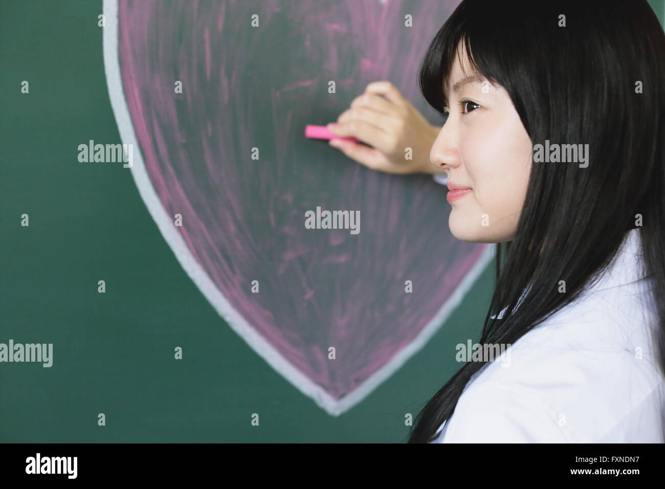 Japanese high-school student writing on classroom blackboard Stock ...