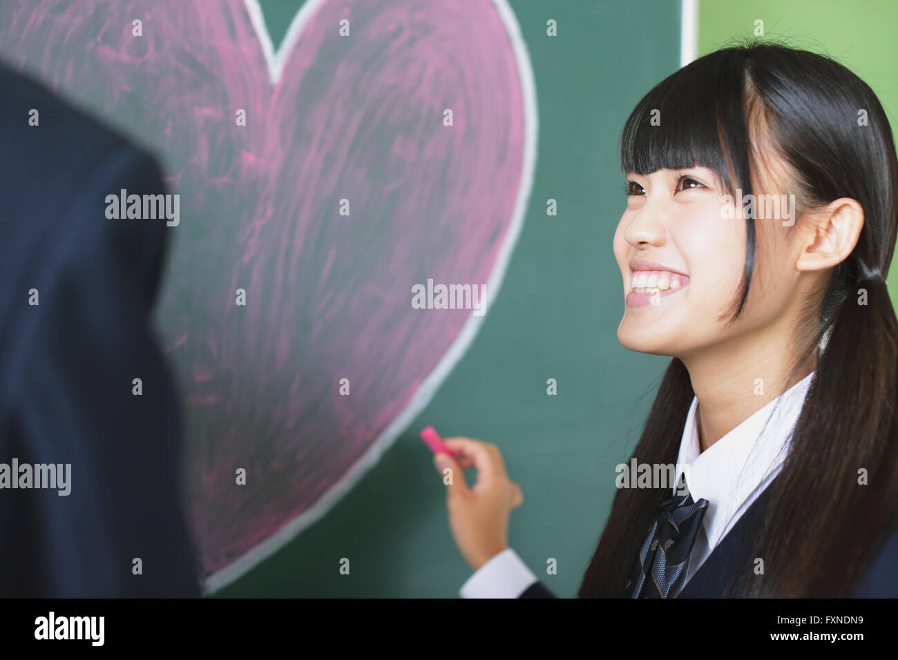 Japanese high-school students writing on classroom blackboard Stock ...
