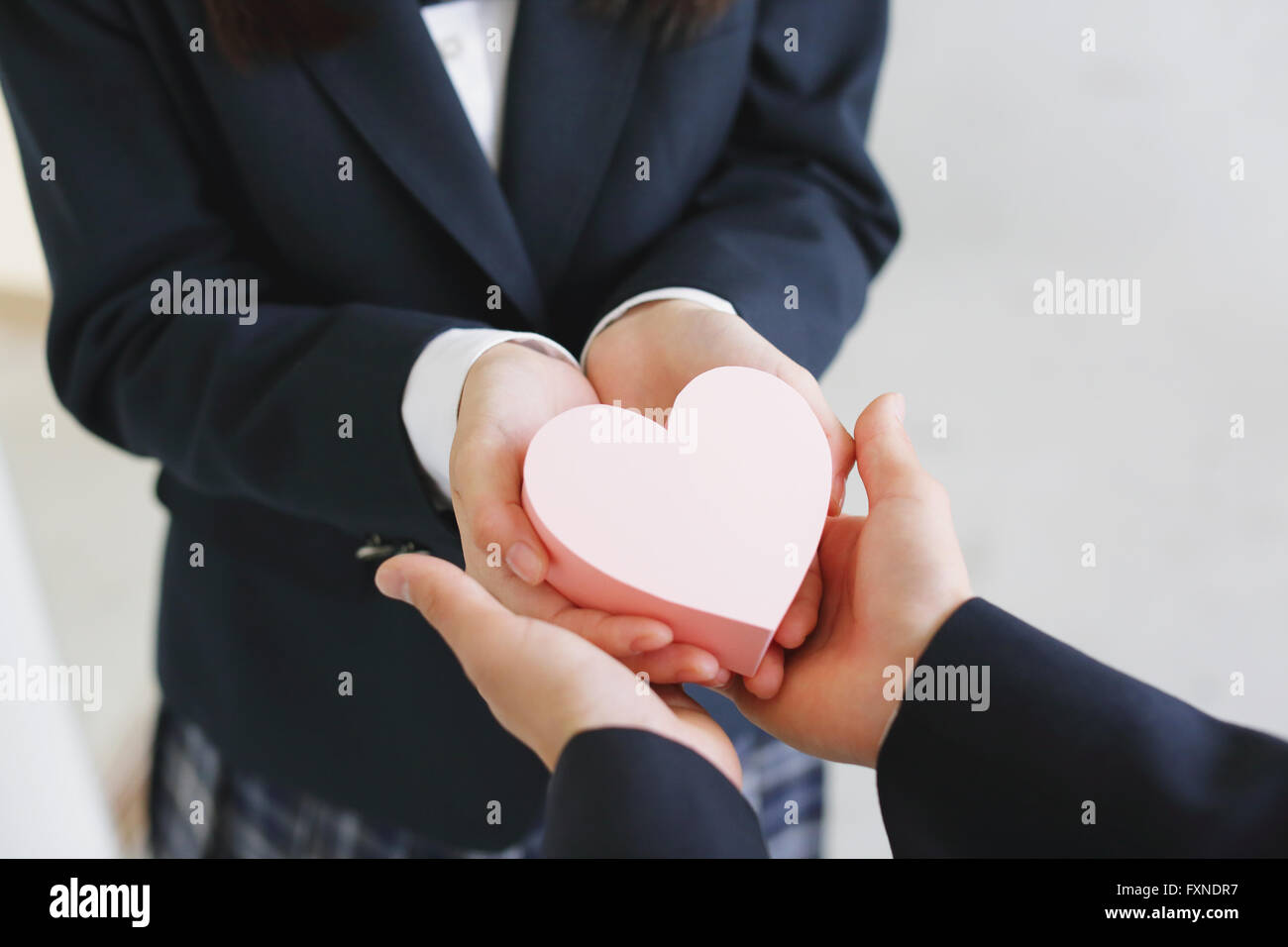 Japanese high-school student giving present Stock Photo - Alamy