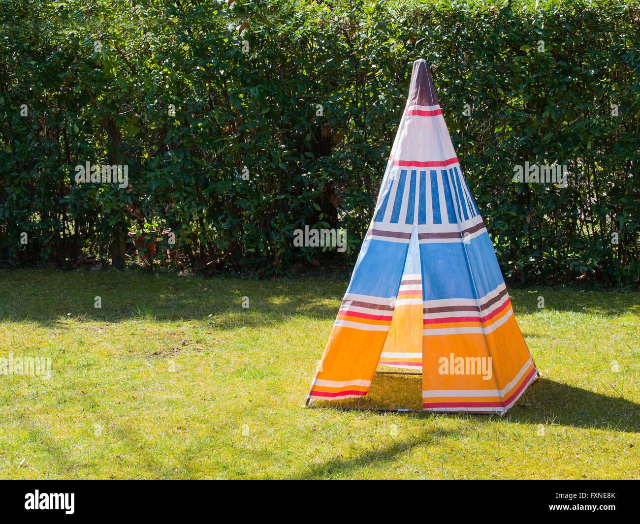 Colorful child's toy Teepee tent of native American made of canvas on ...